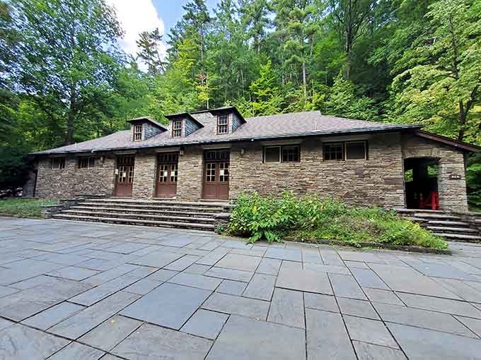 The historic bathhouse stands ready to serve swimmers, built with that classic state park stone craftsmanship.