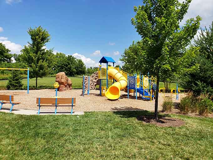 That yellow slide promises squeals of joy, while parents claim the nearby benches for well-deserved coffee breaks.