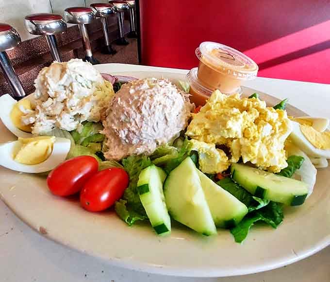 Even the salads here come supersized, because apparently moderation isn't in this diner's vocabulary at all.