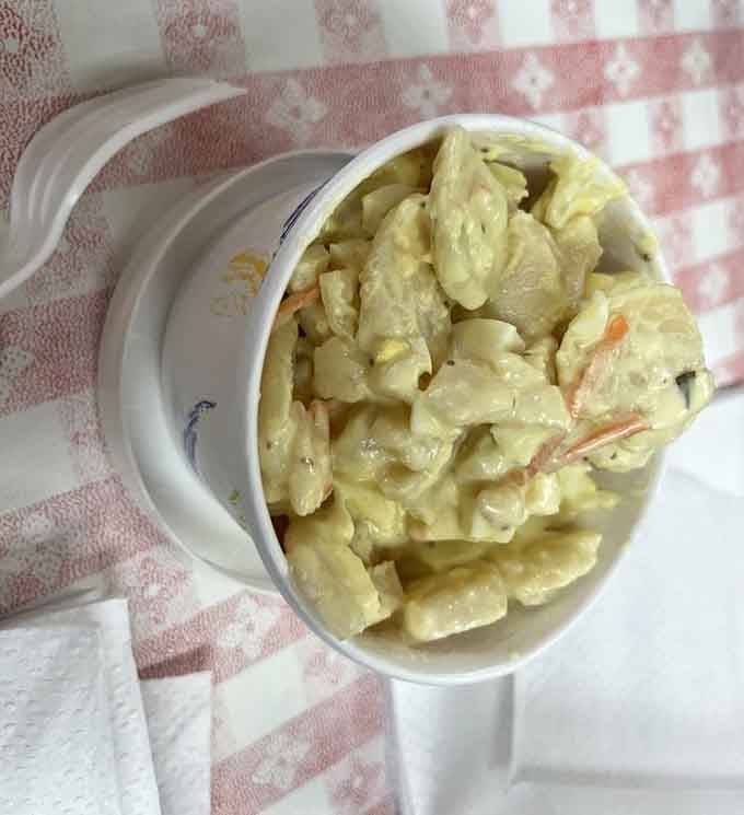 Creamy potato salad that looks like someone's grandmother made it with love and extra mayo.