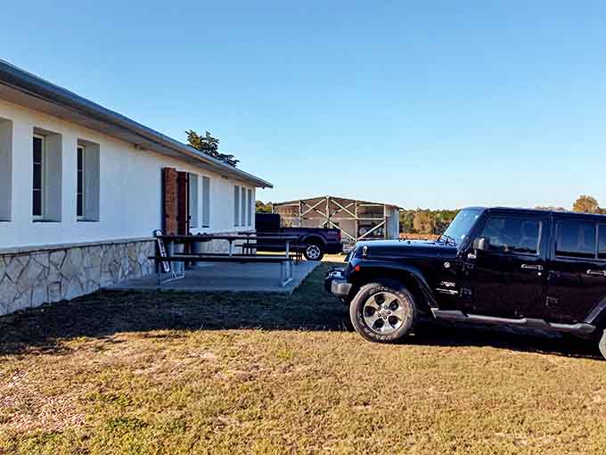 This simple white building houses a winery tasting room where Texas grapes become something worth celebrating with friends.