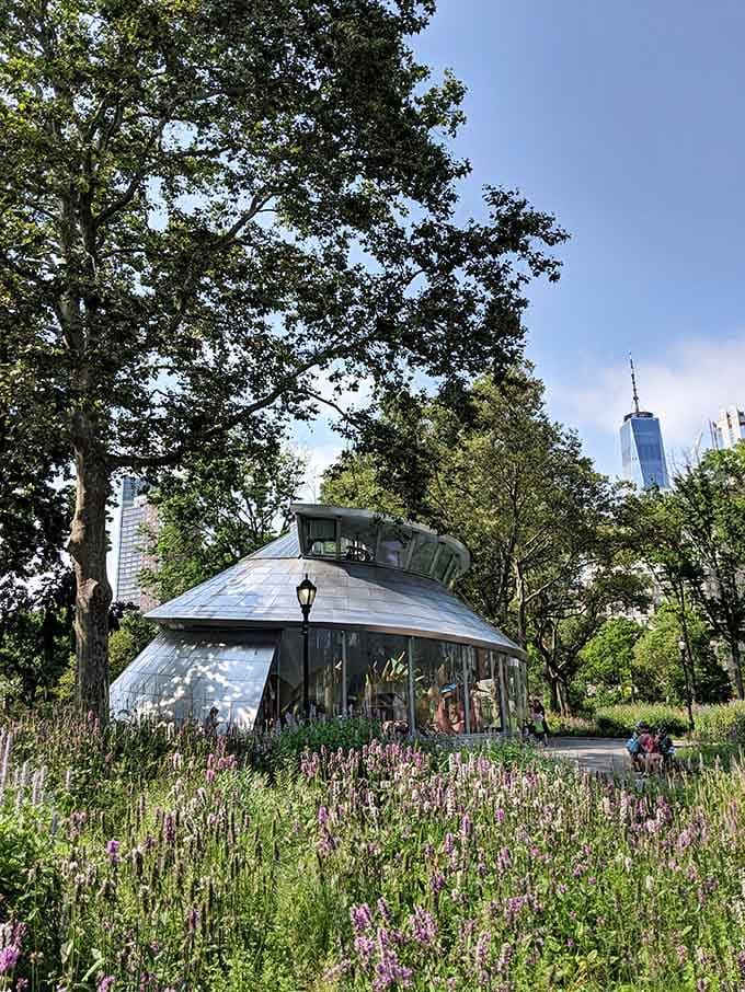 Surrounded by wildflowers and greenery, the pavilion sits like a pearl in an oyster of urban parkland.