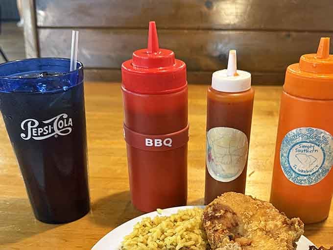 Barbecue sauce bottles lined up like soldiers ready to enhance your already delicious meal experience.