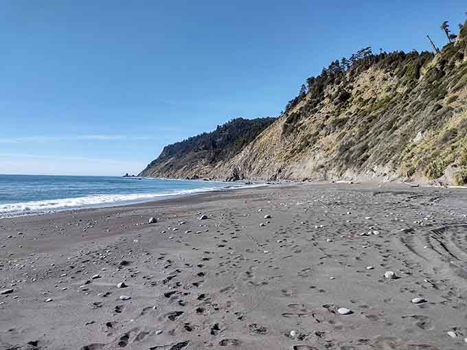 Black sand beaches stretch endlessly where dramatic cliffs plunge into the churning Pacific Ocean.