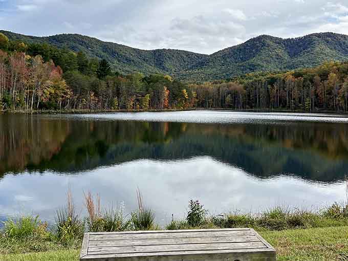 The lake reflects mountains and sky so perfectly you might forget which way is actually up.
