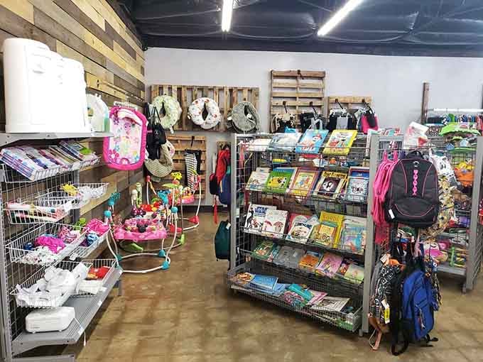 Organized displays showcase everything from books to backpacks, proving chaos and curation can coexist beautifully under one roof.