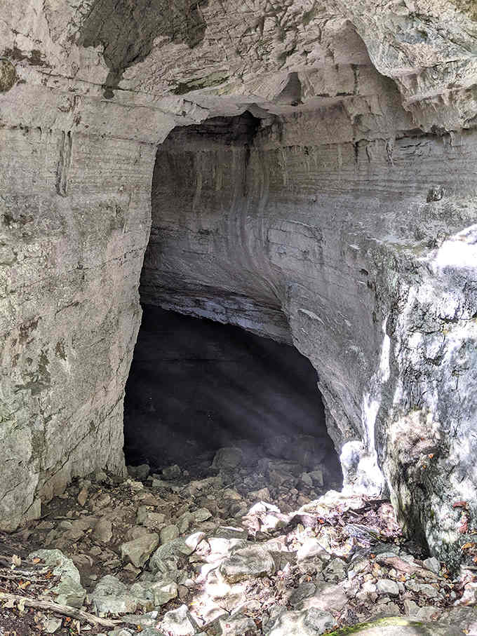 Side entrances to the cave system beckon experienced explorers, though the main pit remains the undisputed star of the show.