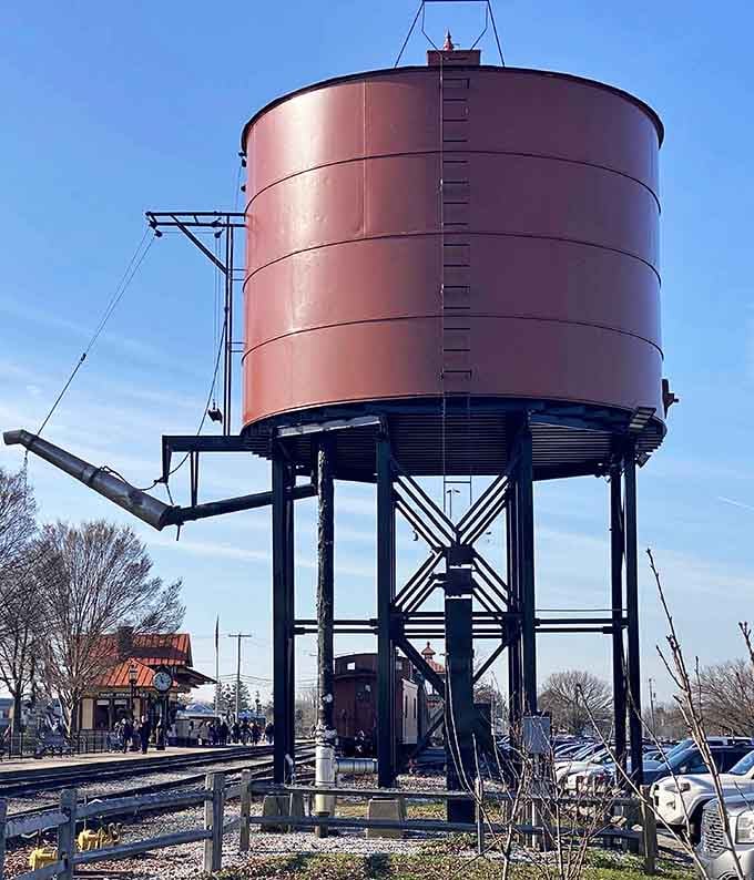 That massive water tower isn't just photogenic, it's essential equipment for keeping steam locomotives properly hydrated.