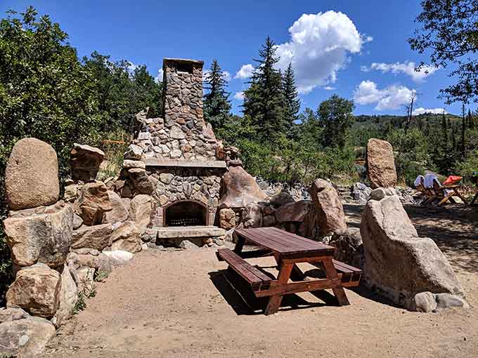 The outdoor stone fireplace provides the perfect spot for warming up between soaks or roasting marshmallows like a civilized human.