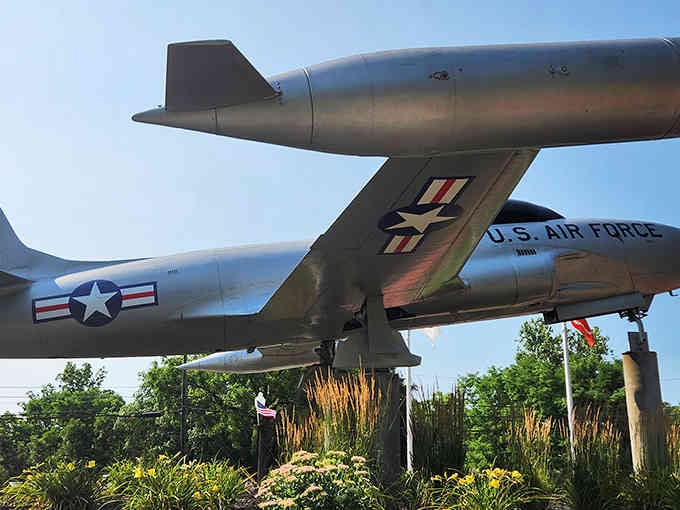 A retired Air Force jet proving that even military aircraft appreciate a good garden view.