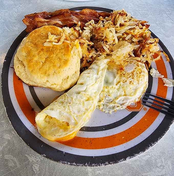 Bacon, eggs, hashbrowns, and a biscuit walk into a plate, and nobody leaves hungry or disappointed after this meeting.