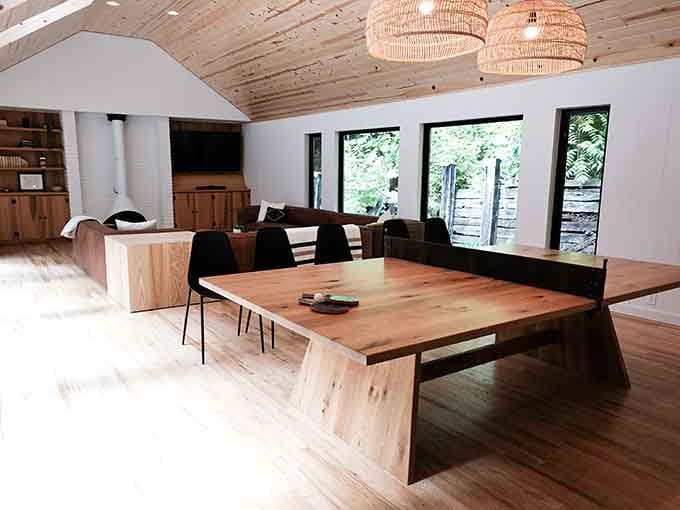 Open-concept living gets a whole new meaning when the concept includes panoramic forest views and natural wood everywhere.