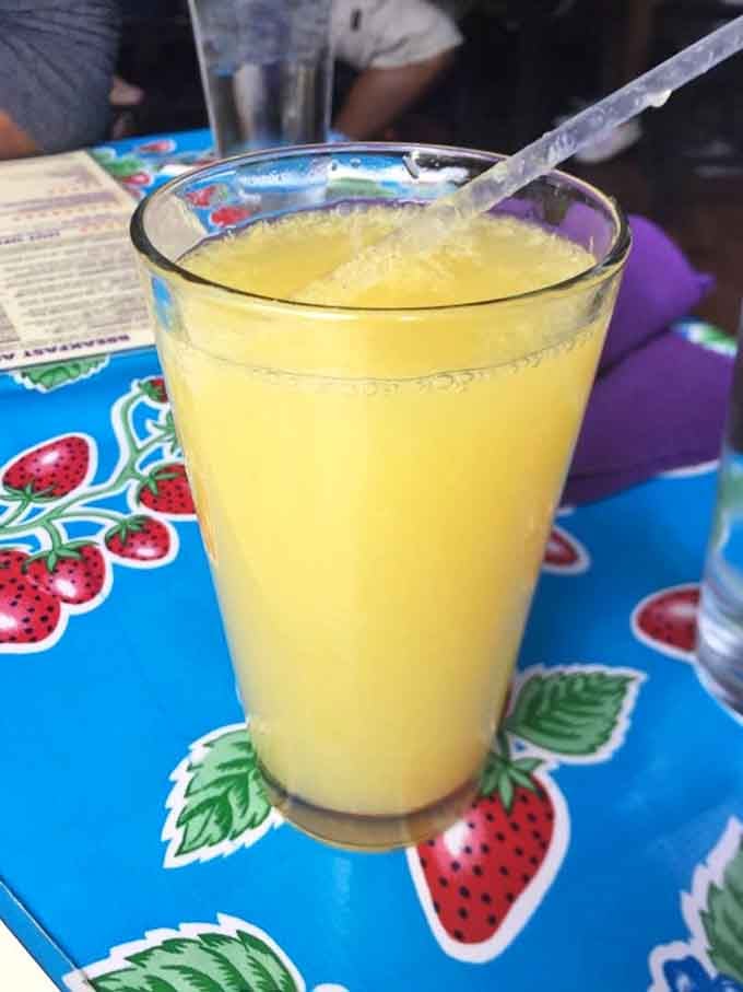 Fresh-squeezed orange juice in a frosty glass tastes like liquid sunshine on a lazy Sunday morning brunch.