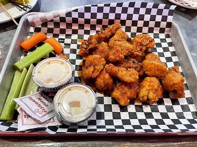 Golden, crispy boneless wings served in a checkered basket&mdash;comfort food that doesn't require an engineering degree to eat.