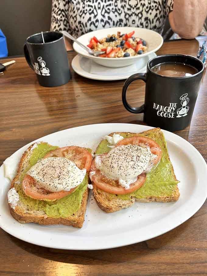 Avocado toast elevated to art form, served with coffee in their signature mug for maximum enjoyment.