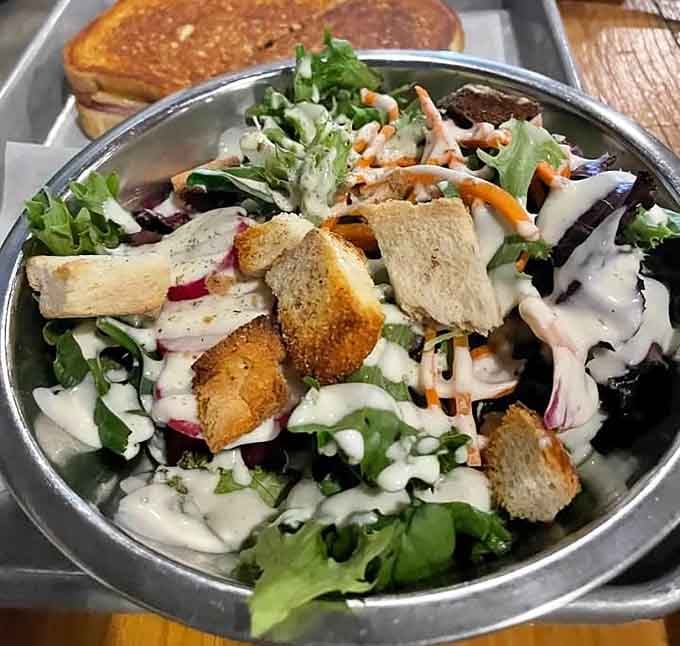 Fresh greens piled high with all the good stuff, because even beer lovers need vegetables sometimes, or so they keep telling us.