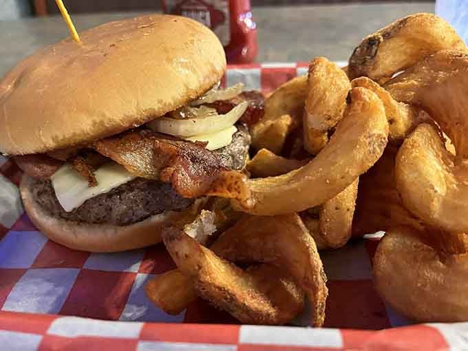A bacon cheeseburger with crispy onion rings on the side is simple perfection done exactly right.