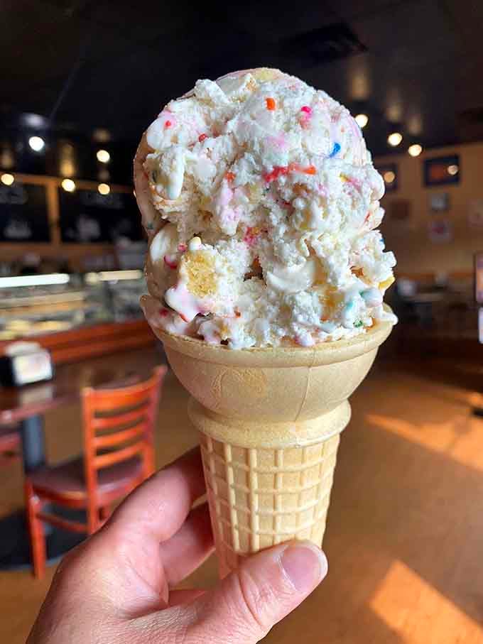 Ice cream cone loaded with sprinkles and whimsy, because sometimes more is definitely more here.