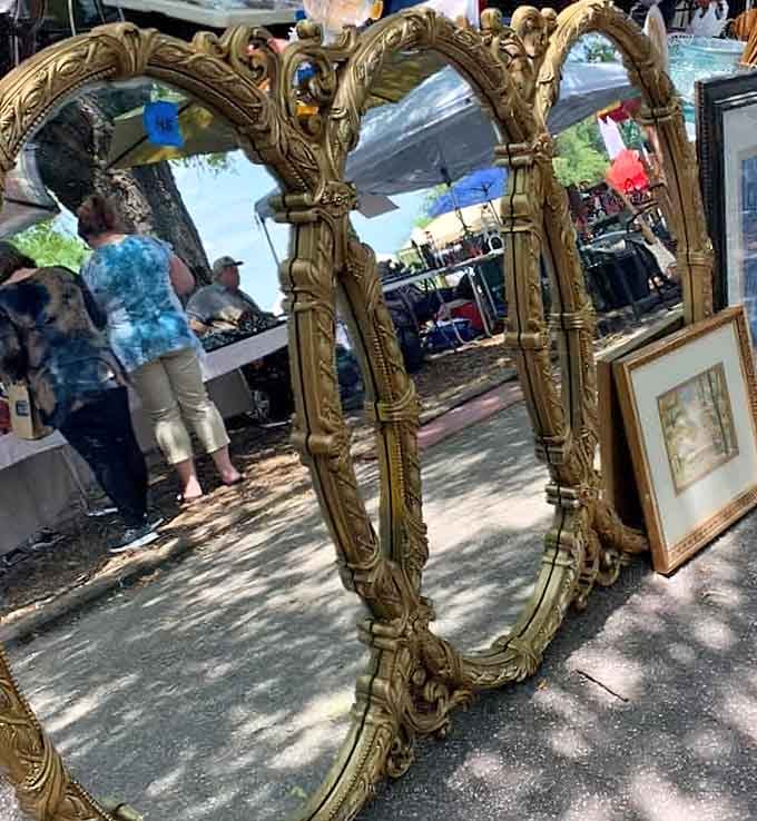Ornate gilded mirrors that have probably reflected more interesting faces than your bathroom ever will.