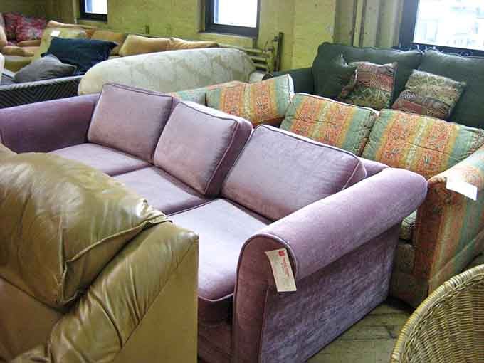 That purple couch is giving serious "I'm sophisticated but also fun at parties" energy, and honestly, same.