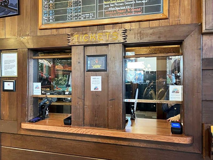 That vintage ticketing booth is where your journey begins, complete with old-school charm and modern convenience combined.