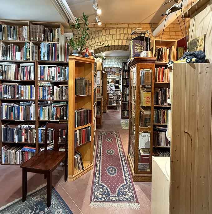 Floor-to-ceiling bookshelves in a historic building – because some retail experiences still understand the magic of turning pages.