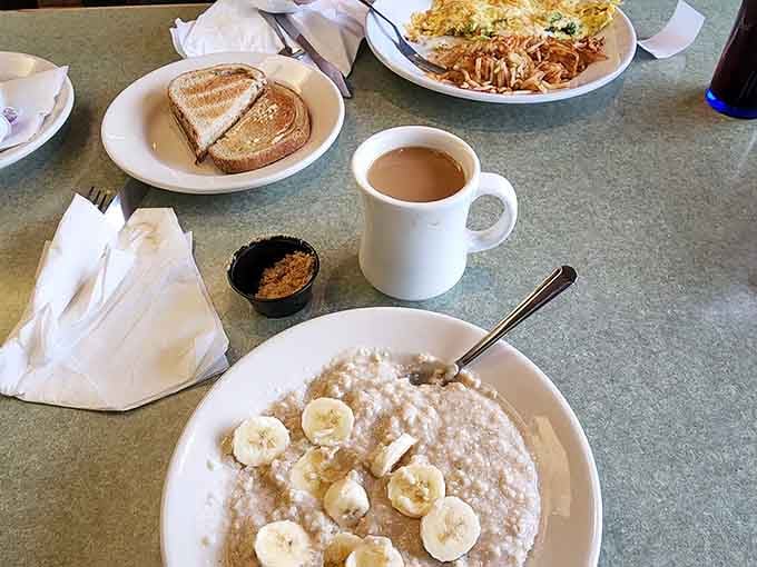 Hot coffee and oatmeal topped with banana slices start your morning right, no cape required for this power breakfast.