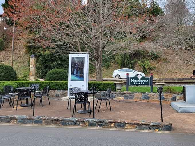 Nina Simone Plaza honors local heritage with outdoor seating perfect for people-watching and afternoon relaxation.