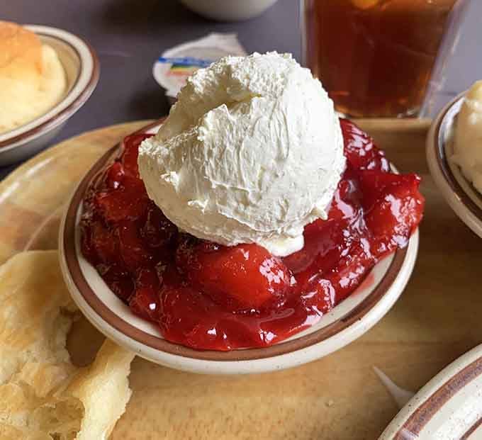Strawberry something topped with whipped cream, proving that dessert stomach is absolutely a real medical condition worth having.
