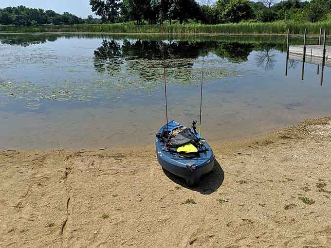 A kayak waits patiently at the water's edge, ready to transform landlubbers into amateur explorers.