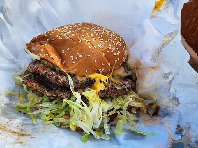 Two patties, bacon, and enough toppings to require architectural engineering, this burger doesn't believe in holding back.