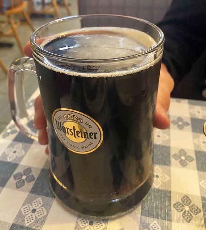 A cold Warsteiner in a proper mug alongside fried chicken is the kind of pairing that makes you question every other meal choice.