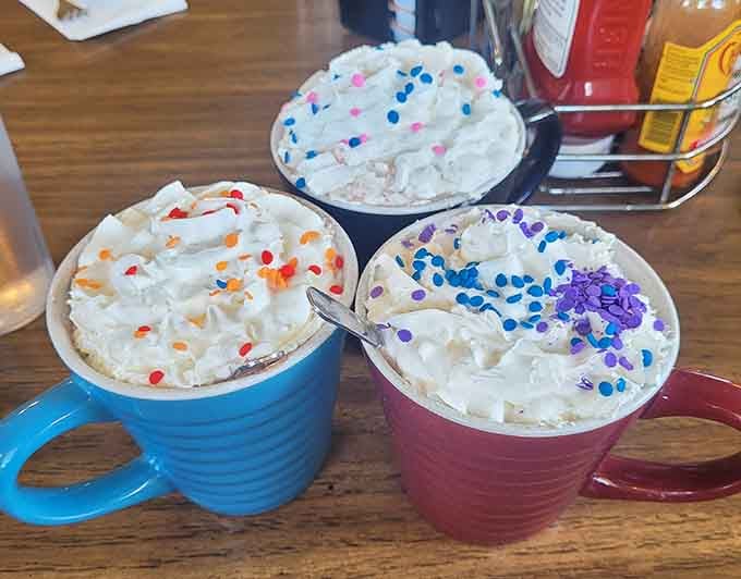 Hot chocolate topped with whipped cream and sprinkles proves dessert for breakfast is always the right choice.