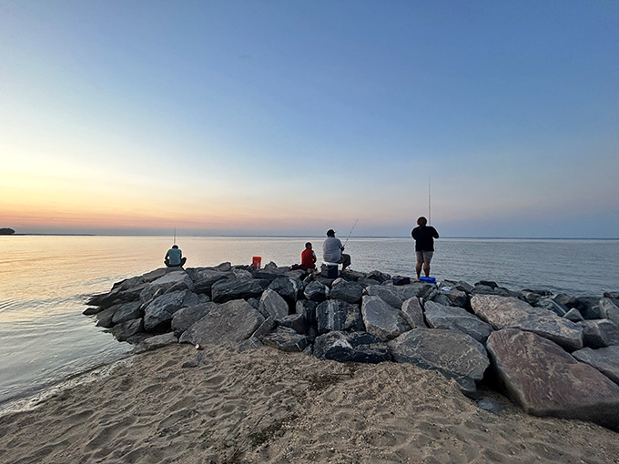Sunset fishing on the jetty, where patience meets the Potomac and dinner might just bite.