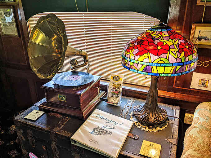 That vintage phonograph and Tiffany lamp create an atmosphere that would make your grandparents nostalgic and jealous simultaneously.