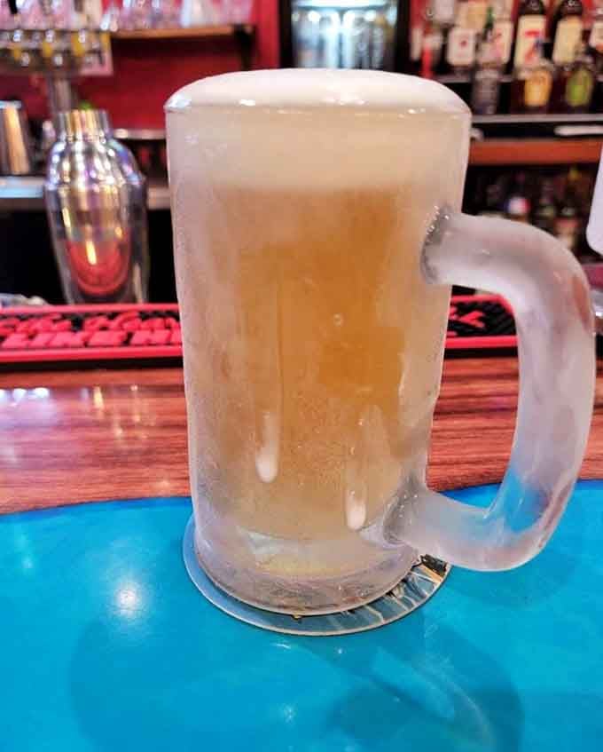 A frosty mug of beer, the perfect companion for conquering that legendary tenderloin waiting at your table.