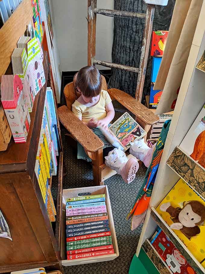 Tucked into this wooden nook with a stuffed companion, reading becomes the coziest adventure you'll have today.