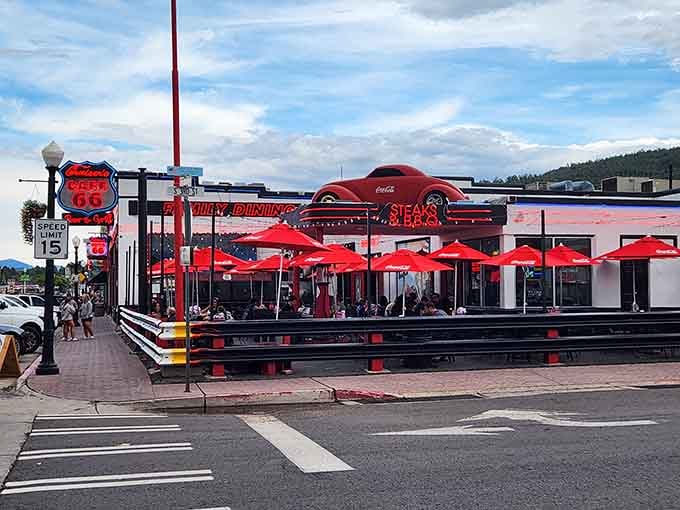 Cruiser's Route 66 Cafe serves up nostalgia with a side of seriously good eats under cheerful red umbrellas.