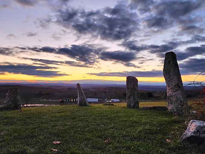Standing stones silhouetted against a painted sky create a mystical atmosphere worthy of ancient legends and modern Instagram feeds.