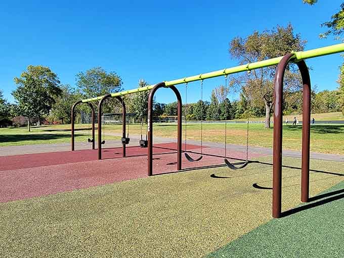 Traditional swings meet modern accessibility, proving that classic playground joy never goes out of style here.