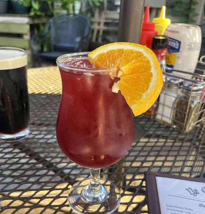 Fresh fruit sangria garnished with orange slices, perfect for sipping while soaking in centuries of tavern atmosphere and good vibes.