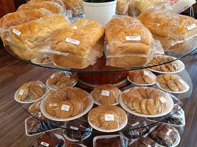 Fresh bread loaves and baked goods stacked high. Everything here is made from scratch, the old-fashioned way.