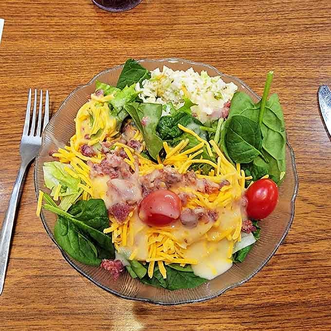 When your salad comes loaded with bacon, cheese, and enough toppings to require architectural support, you're doing it right.