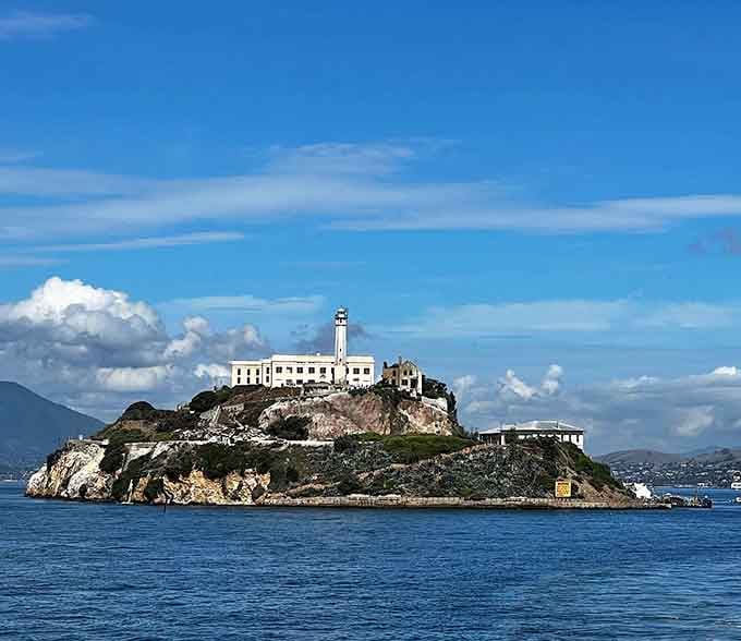 The infamous island prison rises from San Francisco Bay, its lighthouse beacon standing watch over cold, unforgiving waters.