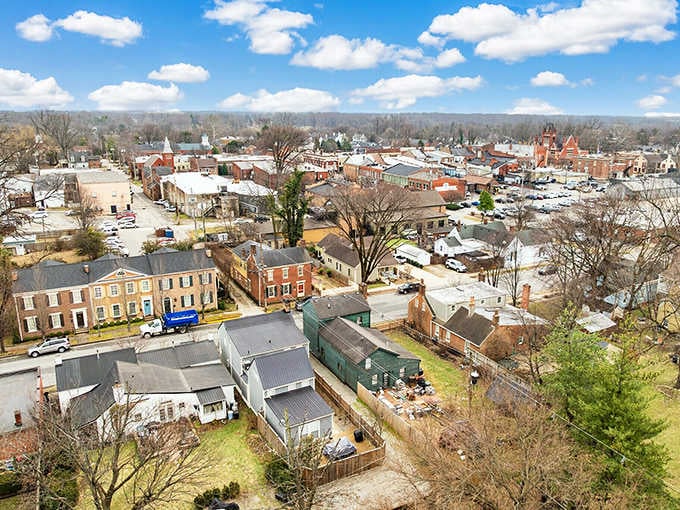 Church steeples punctuate the skyline above a patchwork of historic buildings that define authentic small-town Kentucky charm.
