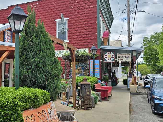 Quilt patterns on buildings and cozy storefronts invite you to slow down and browse like yesterday.