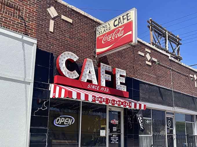 Since 1933, those vintage Coca-Cola signs have been guiding hungry travelers to hot dogs and hometown hospitality.