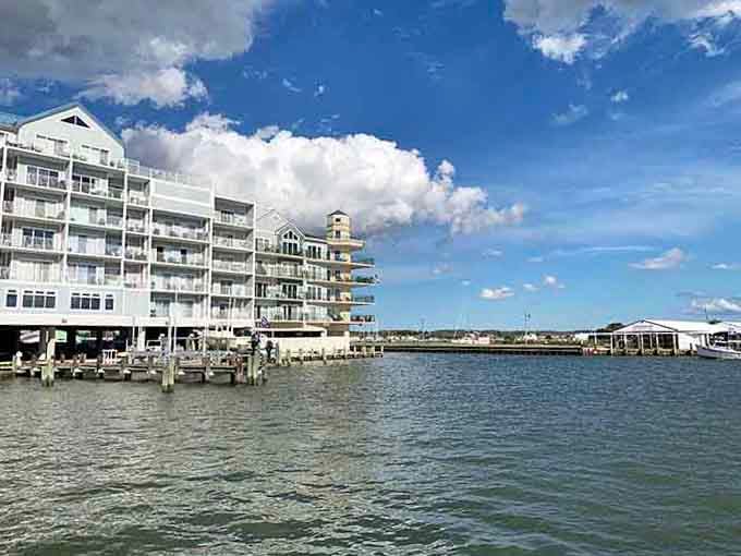 Modern waterfront buildings rise up with balconies that promise morning coffee with million-dollar views every single day.