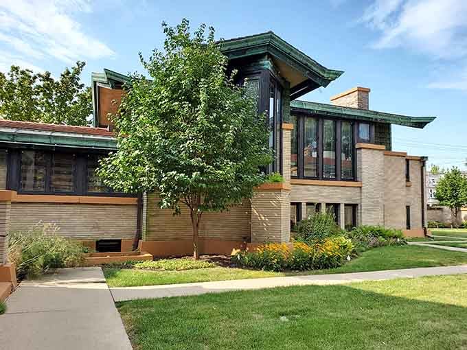 Frank Lloyd Wright's horizontal lines and geometric windows showcase his revolutionary vision, turning a residential street into an architectural pilgrimage site.