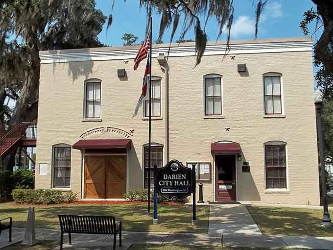 Spanish moss drapes the oaks like nature's curtains, framing City Hall in quintessential coastal Georgia style and elegance.